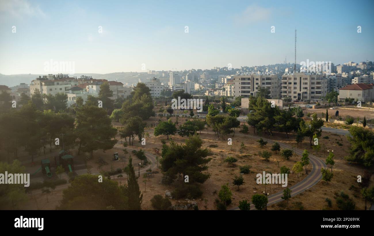 Ramallah Cityscape at Dawn with Sunset, High Buildings and Trees Facing ...