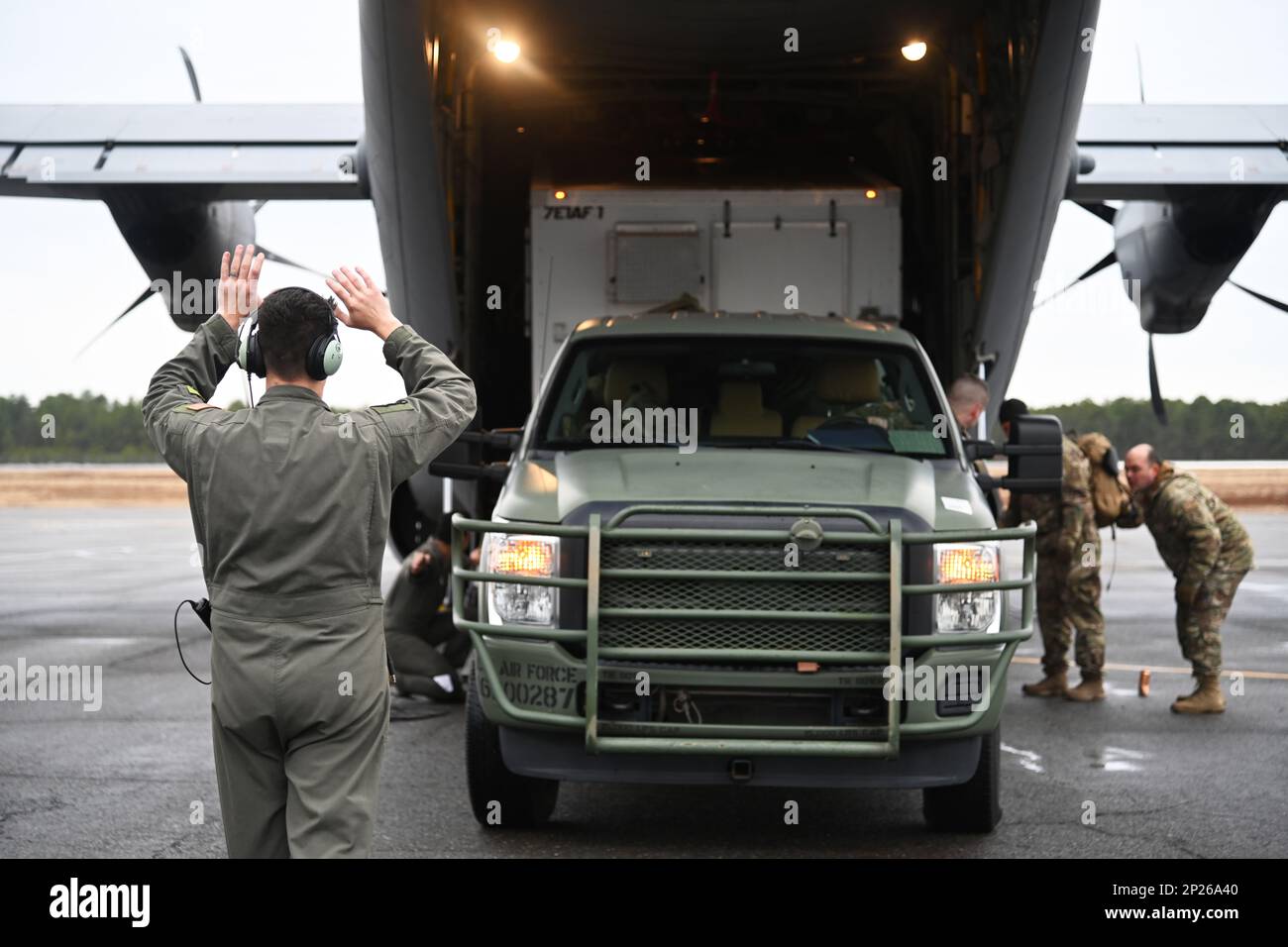 Airmen from the 621st Contingency Response Squadron load cargo during ...