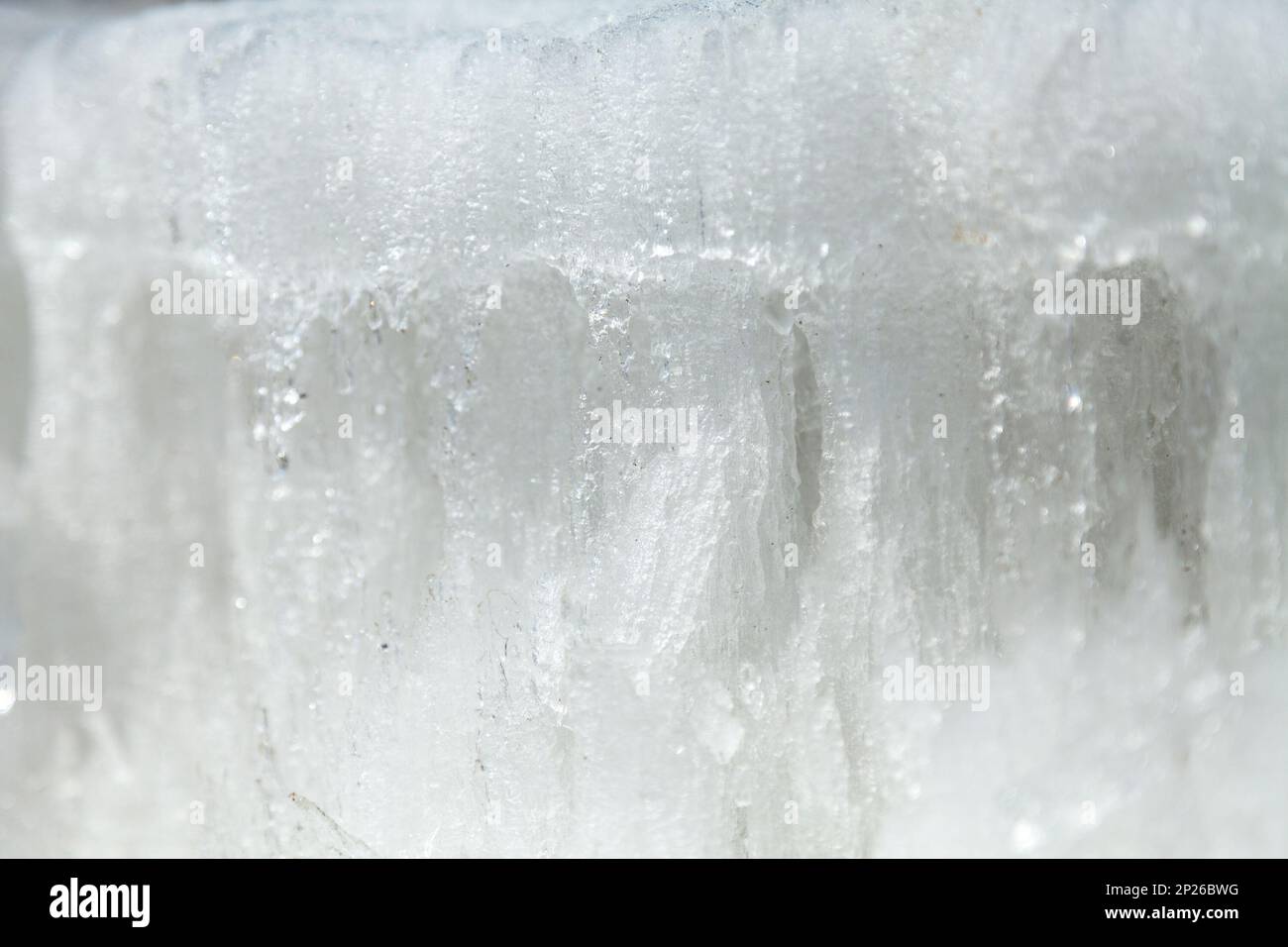 White natural river ice floe melting in the spring sun close-up. Snow ...