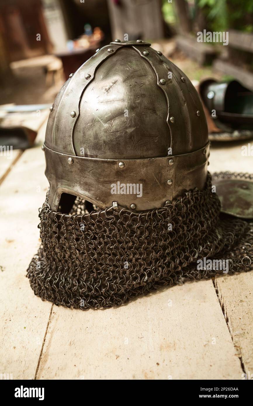 Modern copy of antique metal knight helmet with aventail. Historical ...