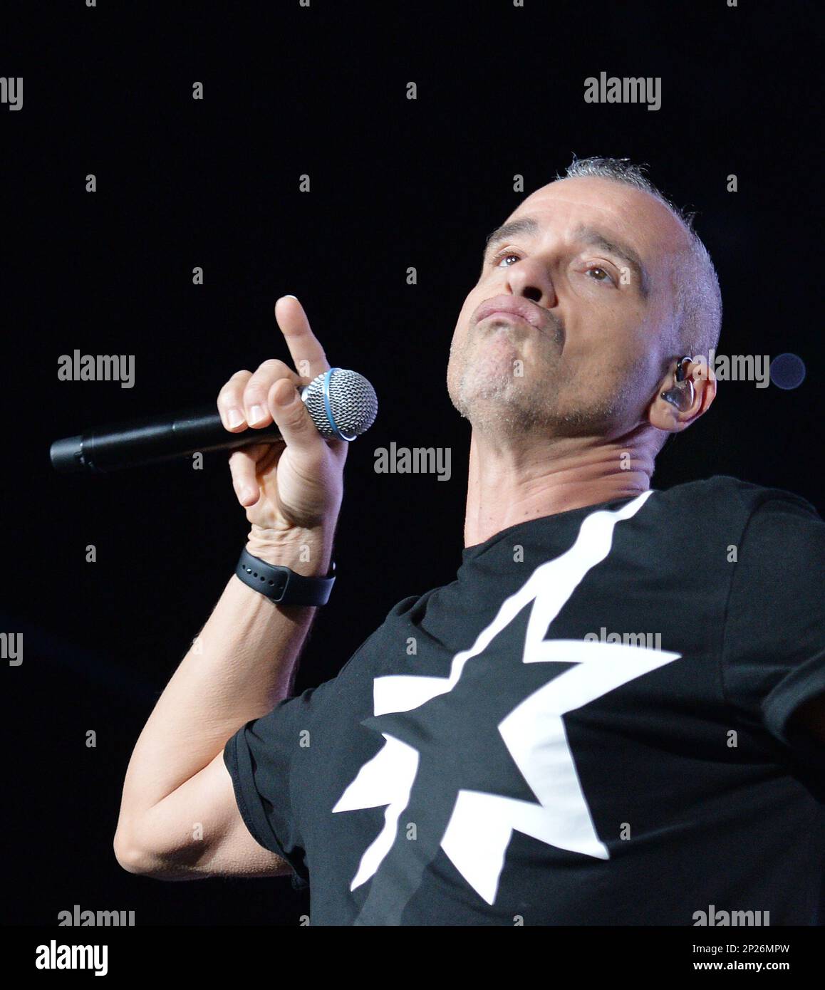 Italian singer Eros Ramazzotti grimaces during his concert in Prague ...