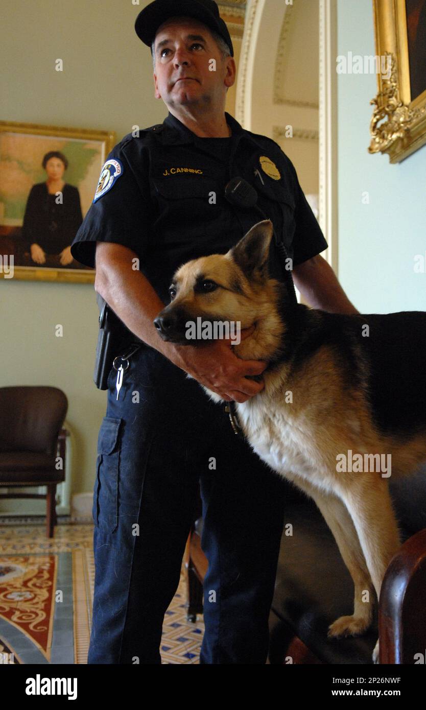 Tech. John Canning of the U.S. Capitol Police and "Ranger" take a break ...