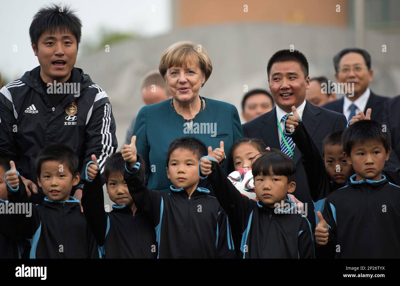 German Chancellor Angela Merkel poses with sports students of the ...