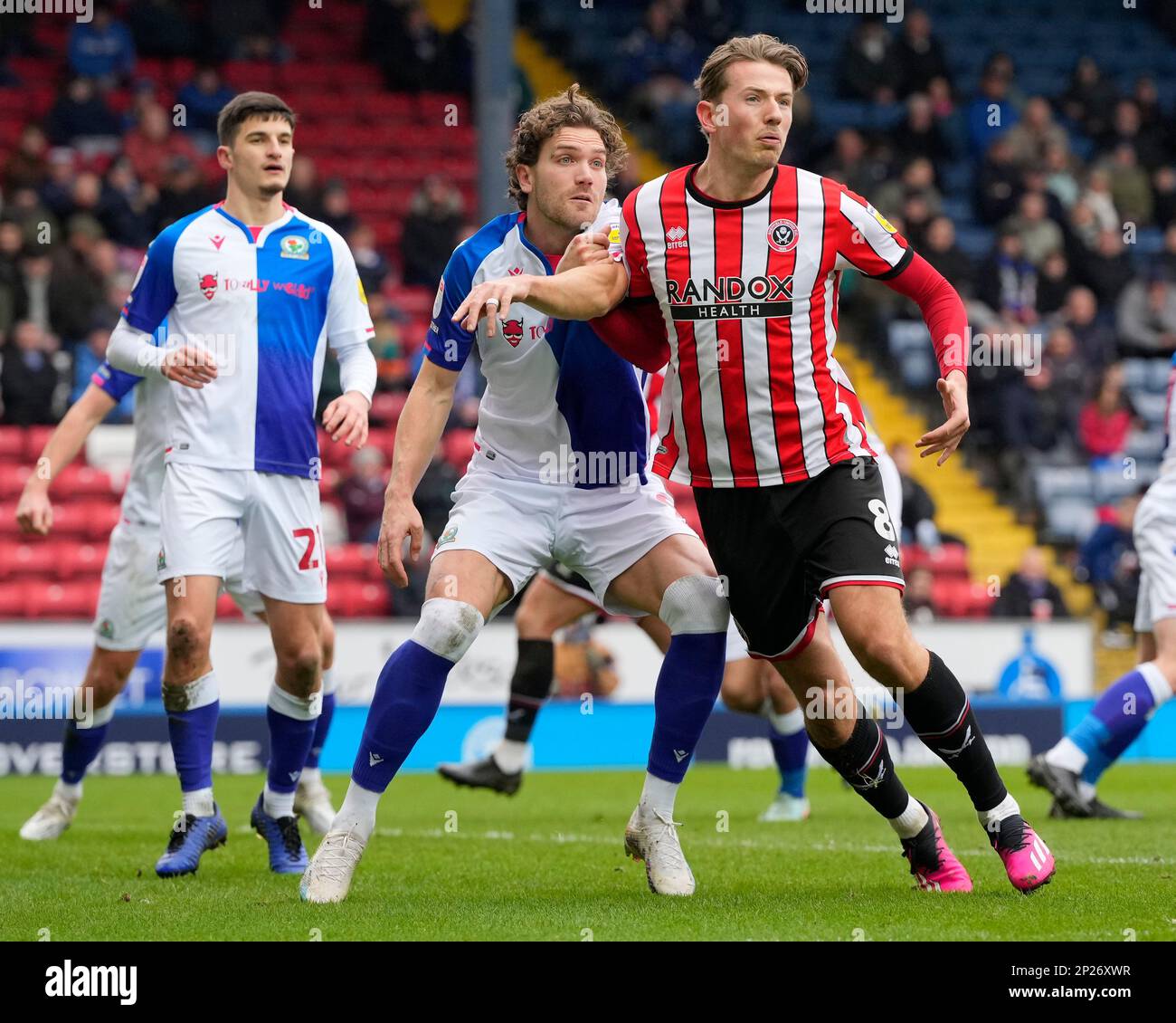 Sam Gallagher #9 of Blackburn Rovers competes with Sander Berge #8 of ...