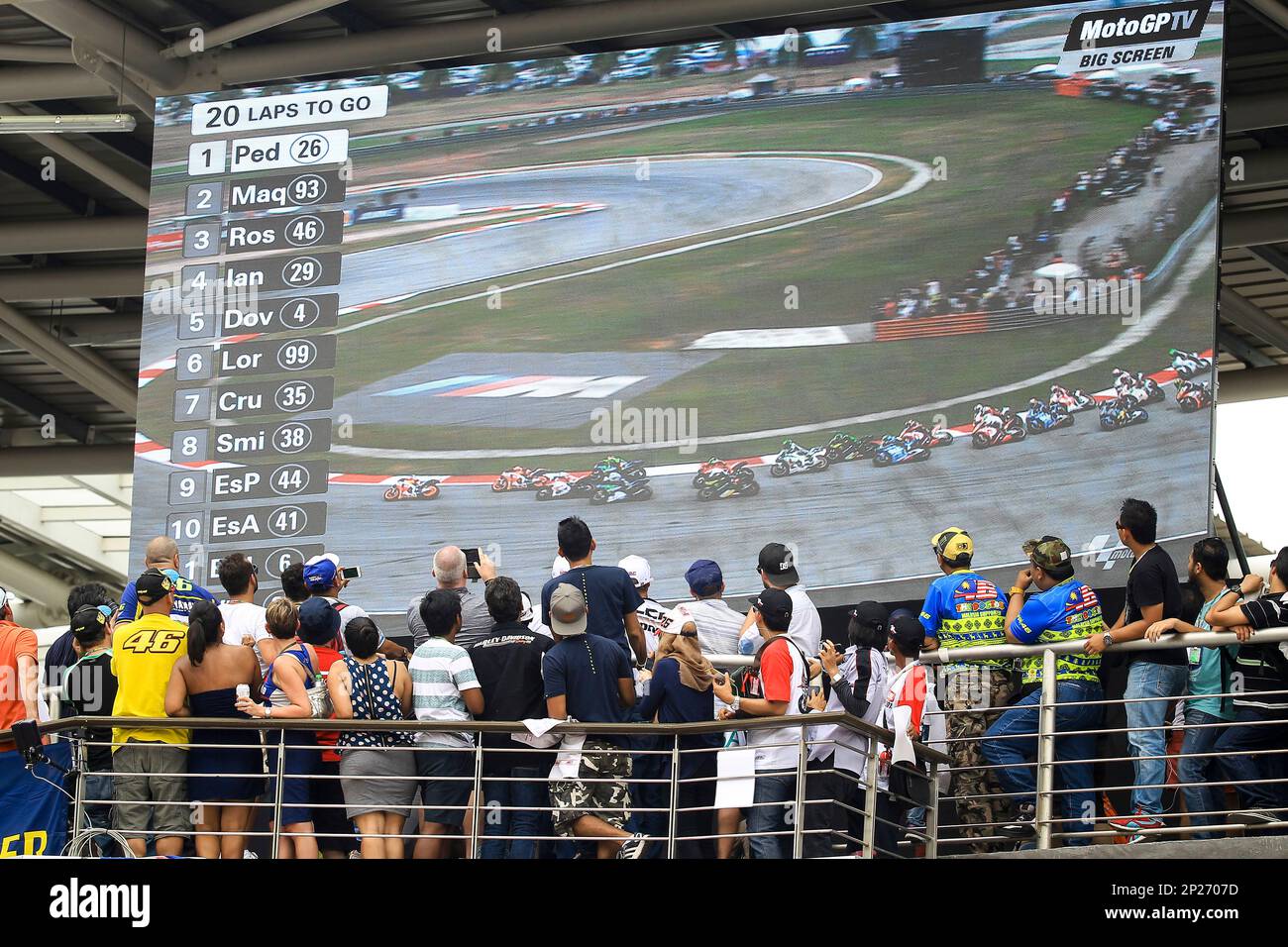 25 October 2015: Spectator watching the race from the giant screen ...