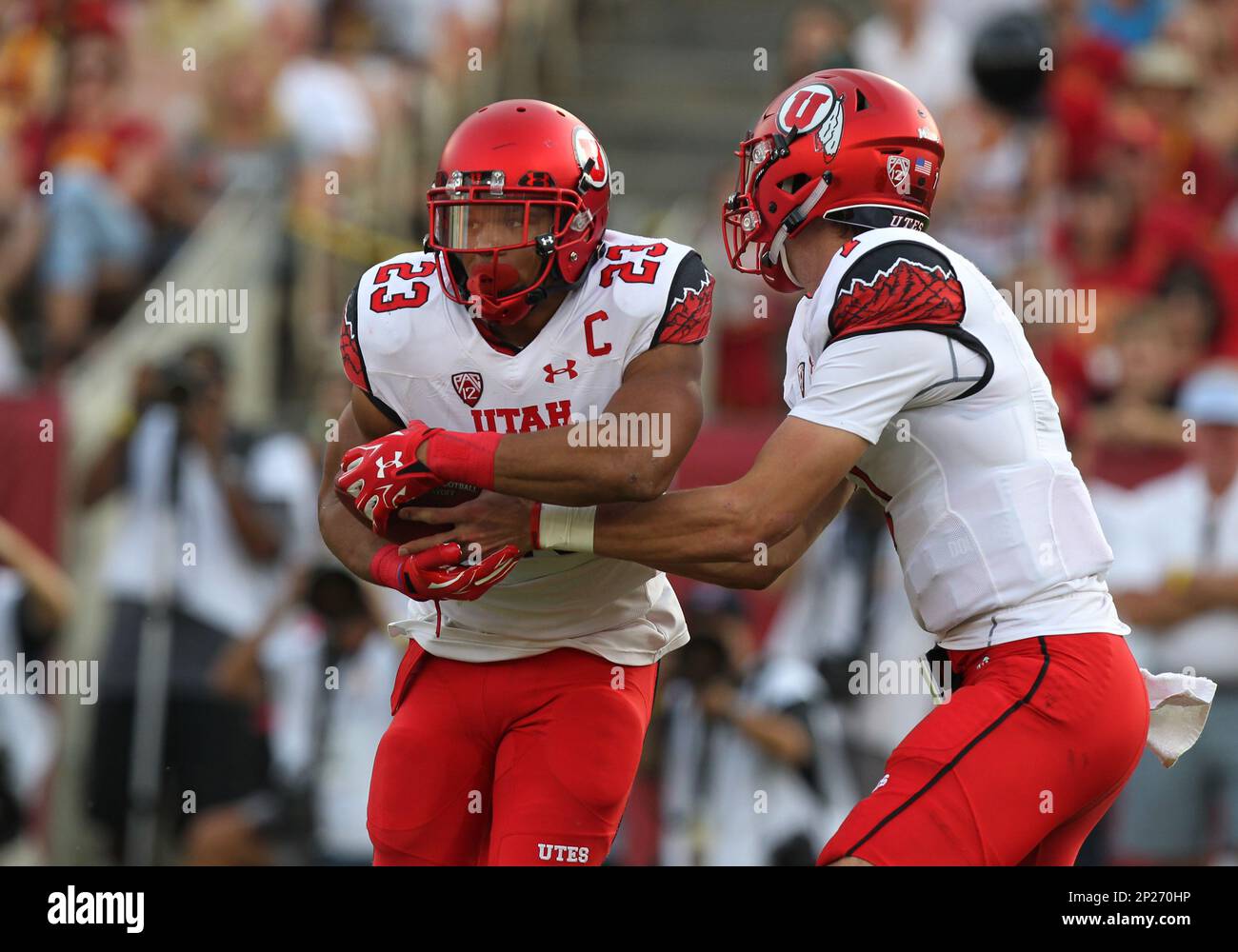 October 24, 2015: Utah Utes quarterback Travis Wilson ( 7 ) hands the ...