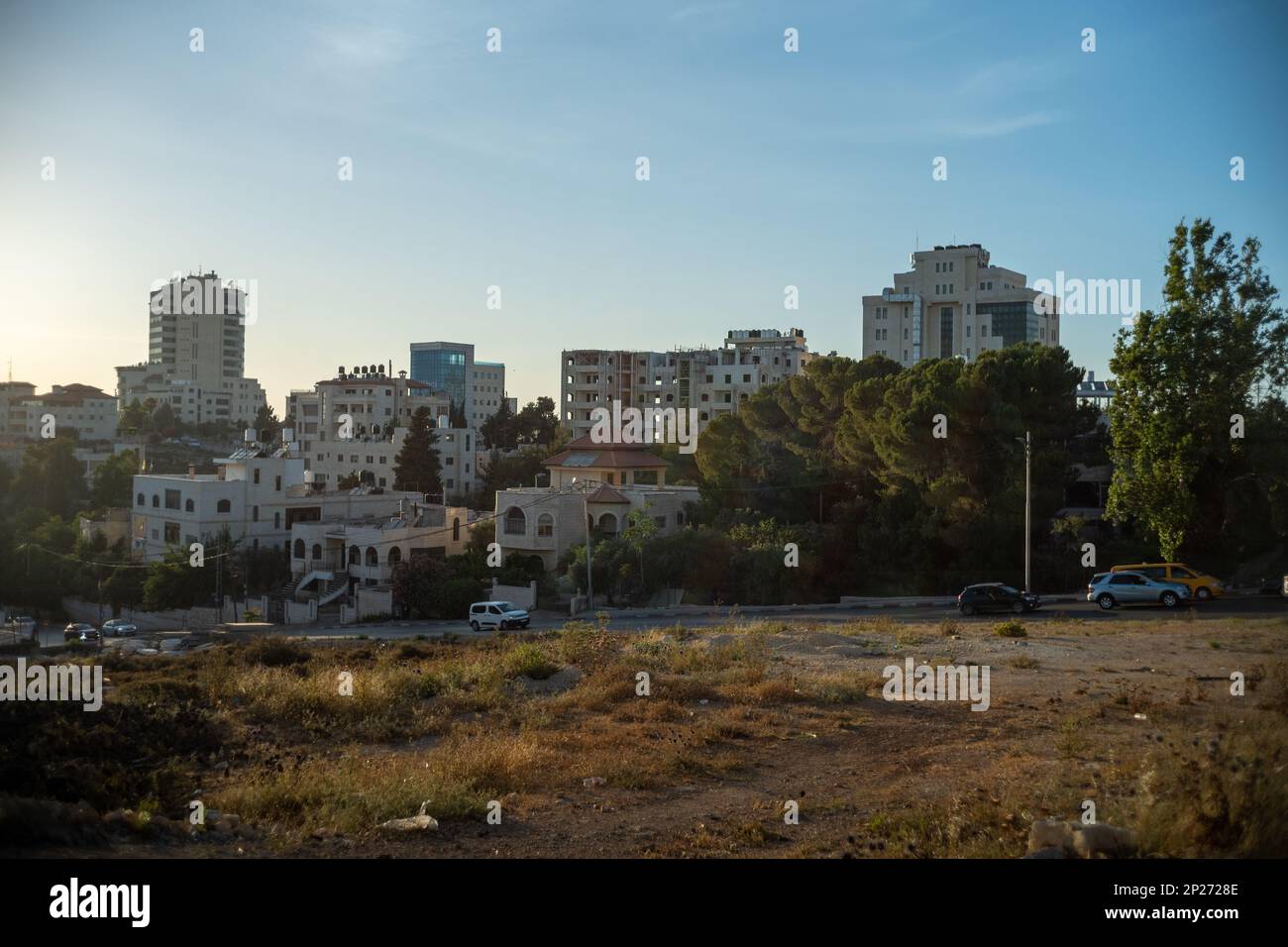 Ramallah Cityscape at Dusk with High Buildings and Trees Stock Photo ...