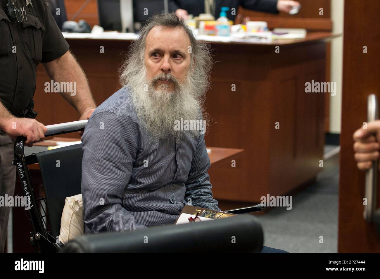 Charles Severance is wheeled out of the courtroom for a short recess ...