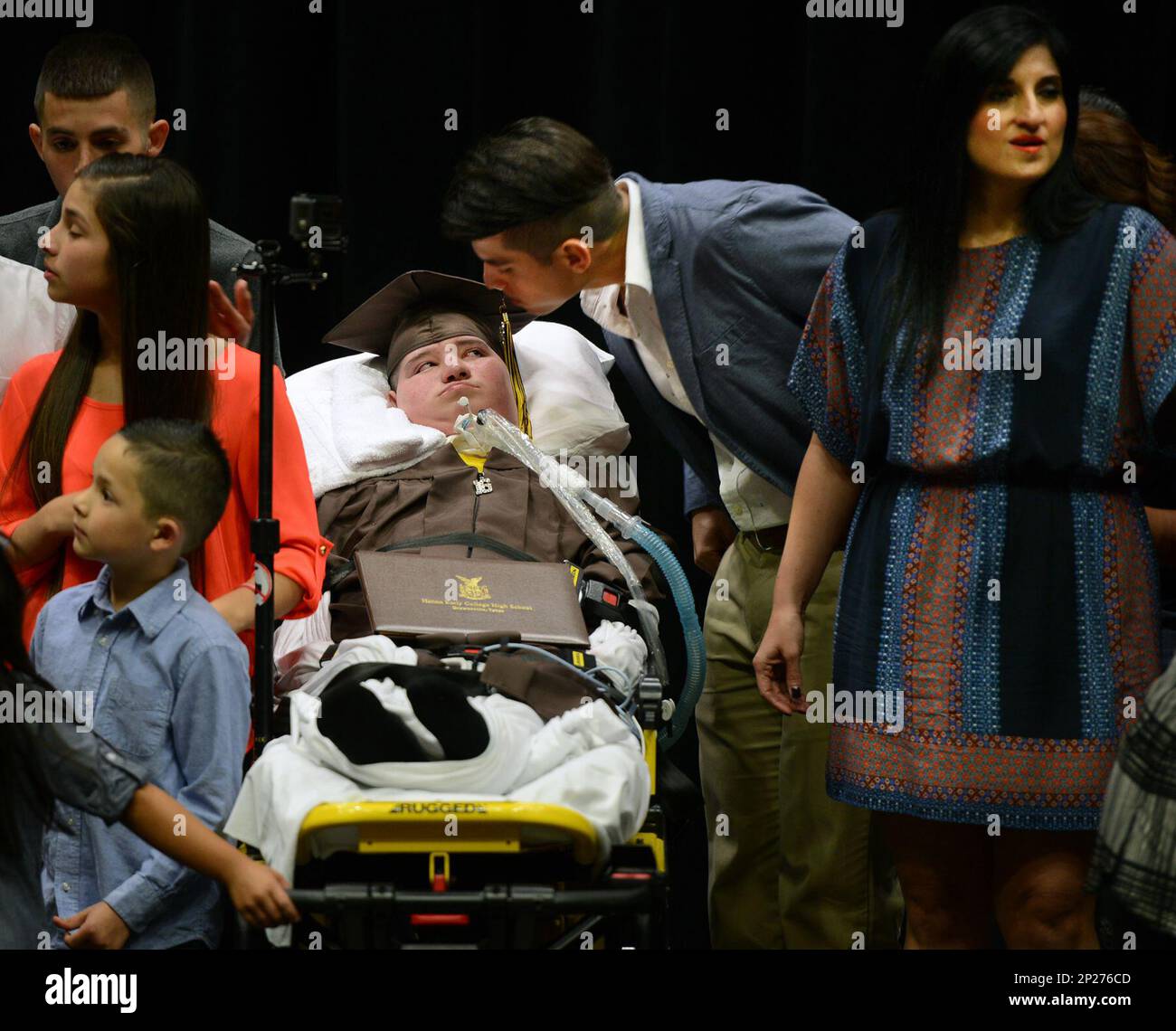 Hanna High School student, Joseph Garza is surrounded by family ...