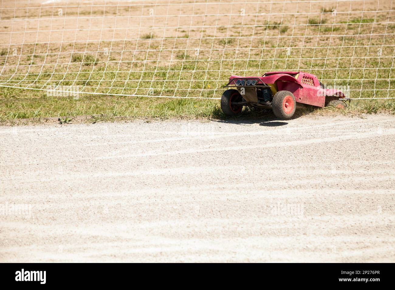 Small radio controlled model car crashed off road. Miniature remote ...