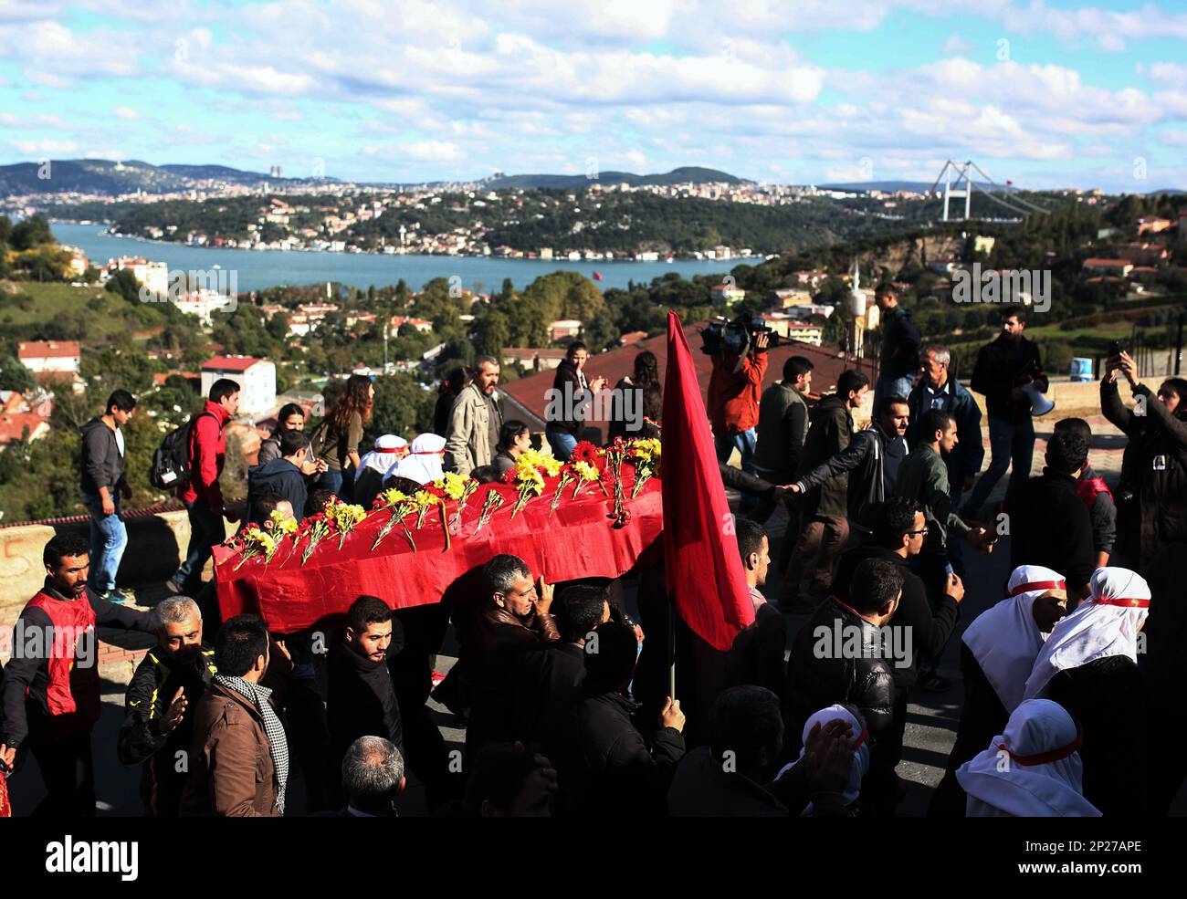 People carry the coffin of Dilek Dogan, a 25-year-old woman who was ...