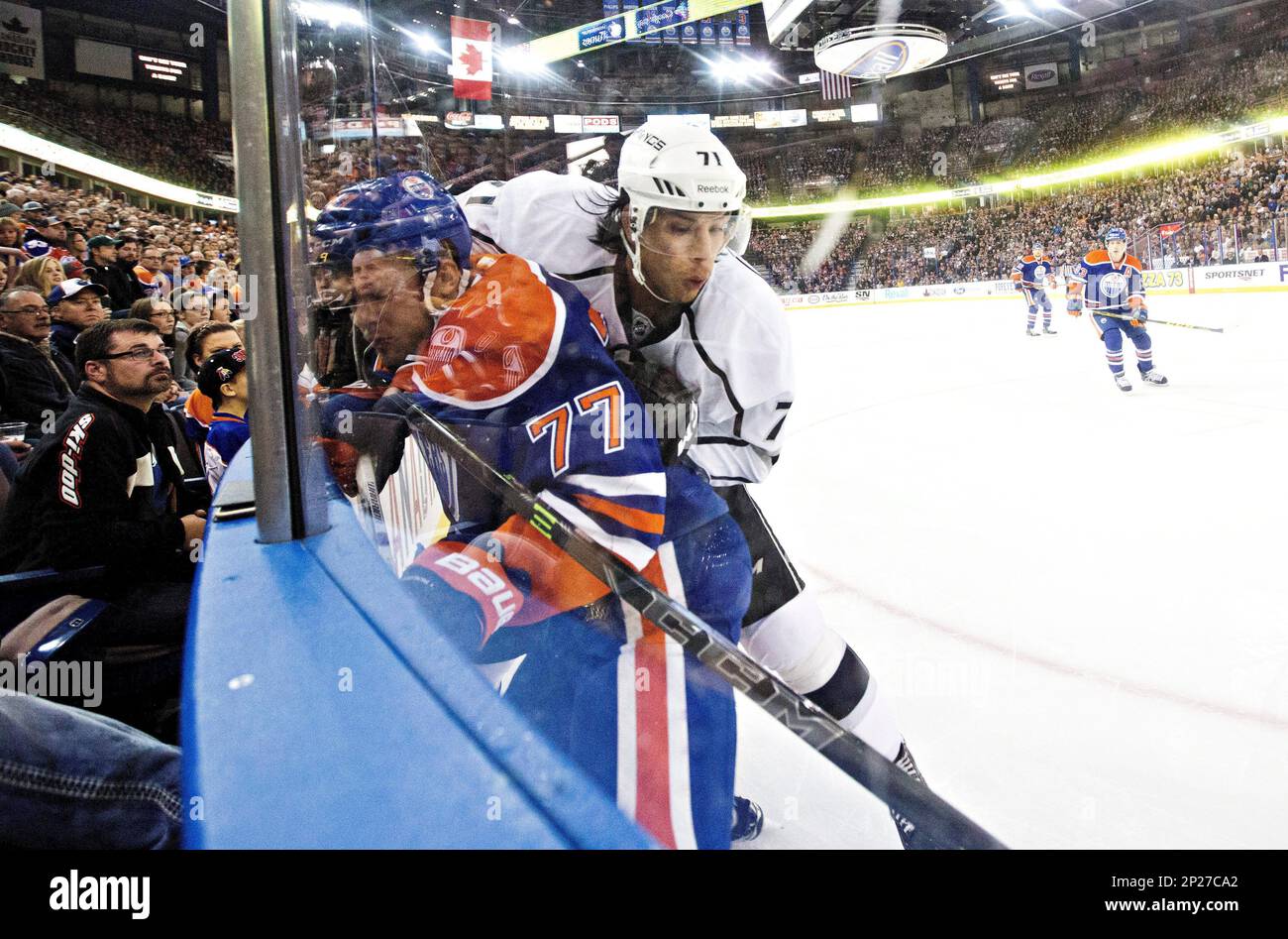 Los Angeles Kings Jordan Nolan (71) checks Edmonton Oilers Oscar ...