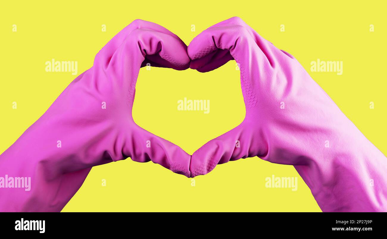 Heart-shaped sign, gesture with hand in violet gloves of cleaner ...