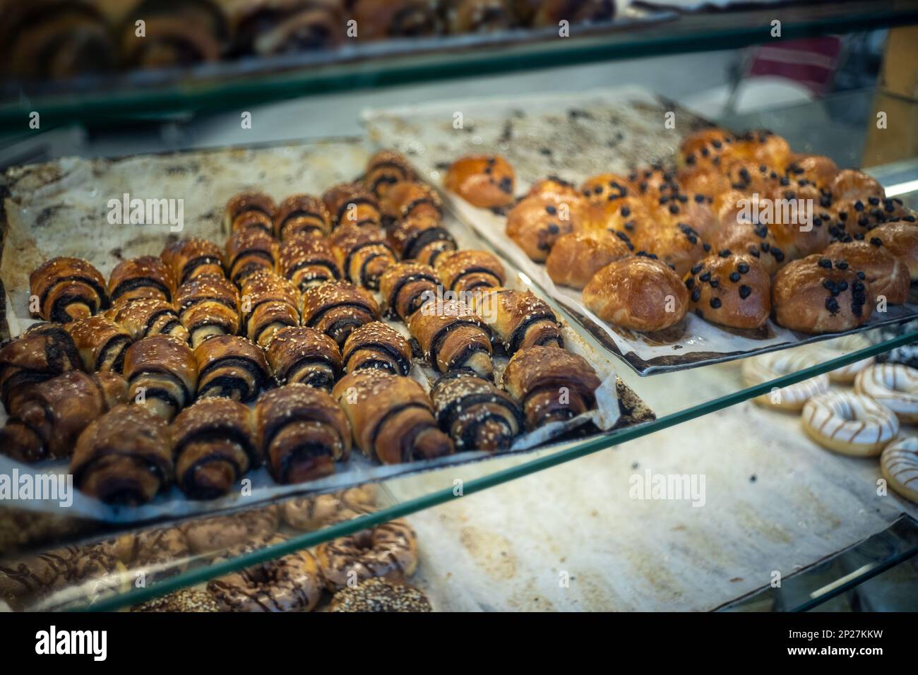 Plates of Tiny Arab Baked Chocolate Croissants in Glass Food Display ...