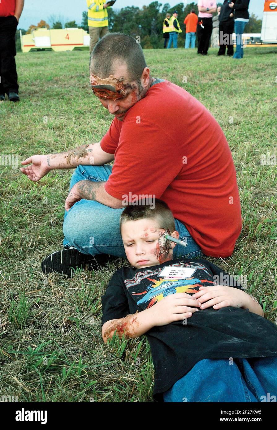 Wearing makeup to simulate injuries, Buddy Jenkins and his 7-year-old ...