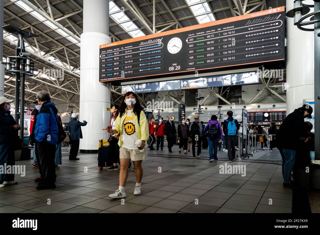 Passengers walk through the Taiwan High Speed Rail (THSR) line terminal ...