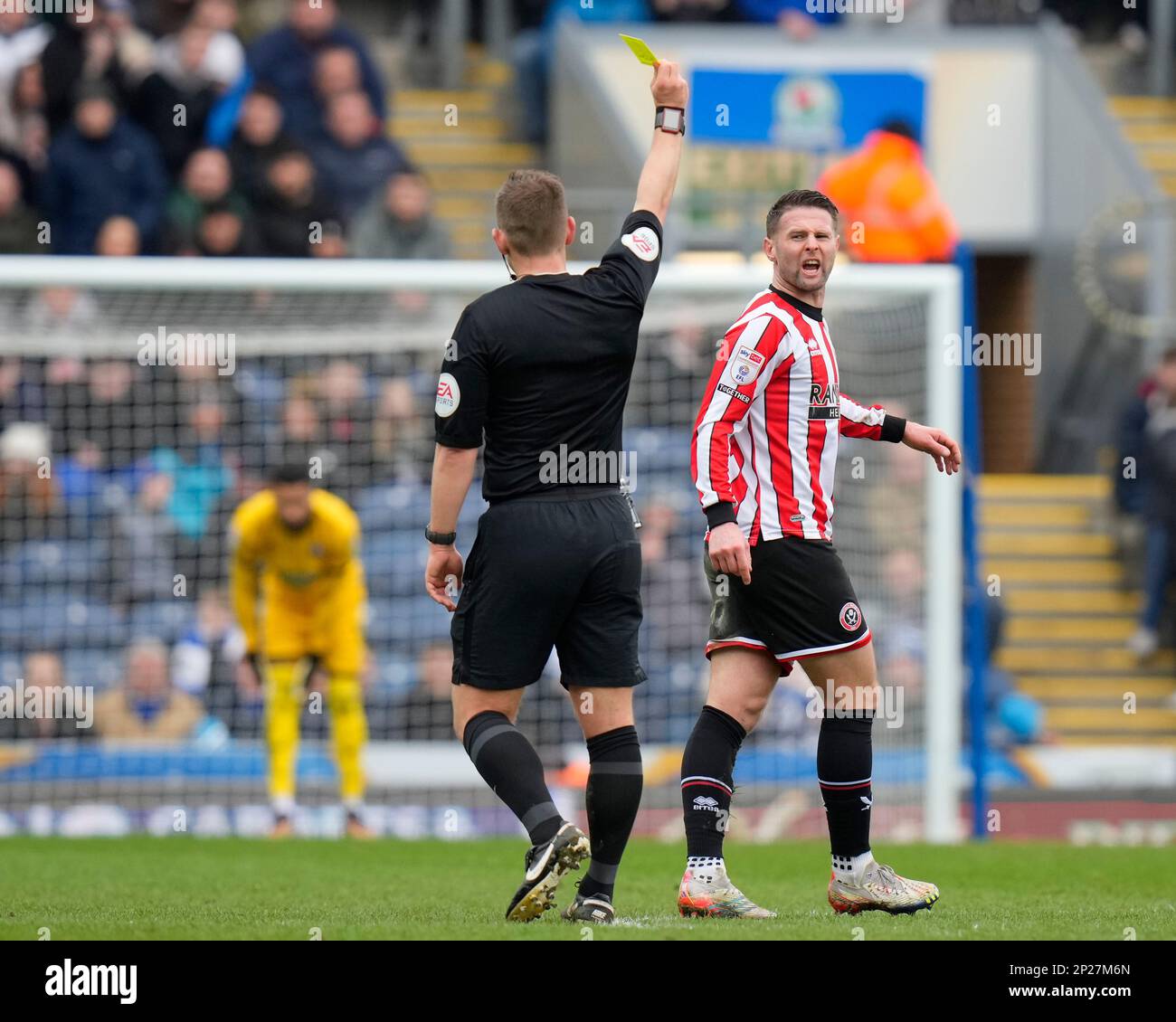 Referee Josh Smith shows a yellow card to Oliver Norwood #16 of ...