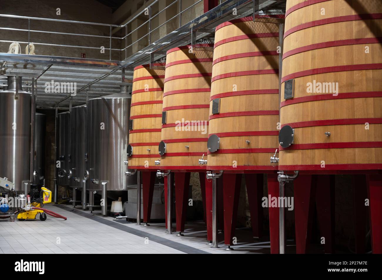 Modern large wooden barrels for wine fermentation process, red and white wine making in La Rioja ...