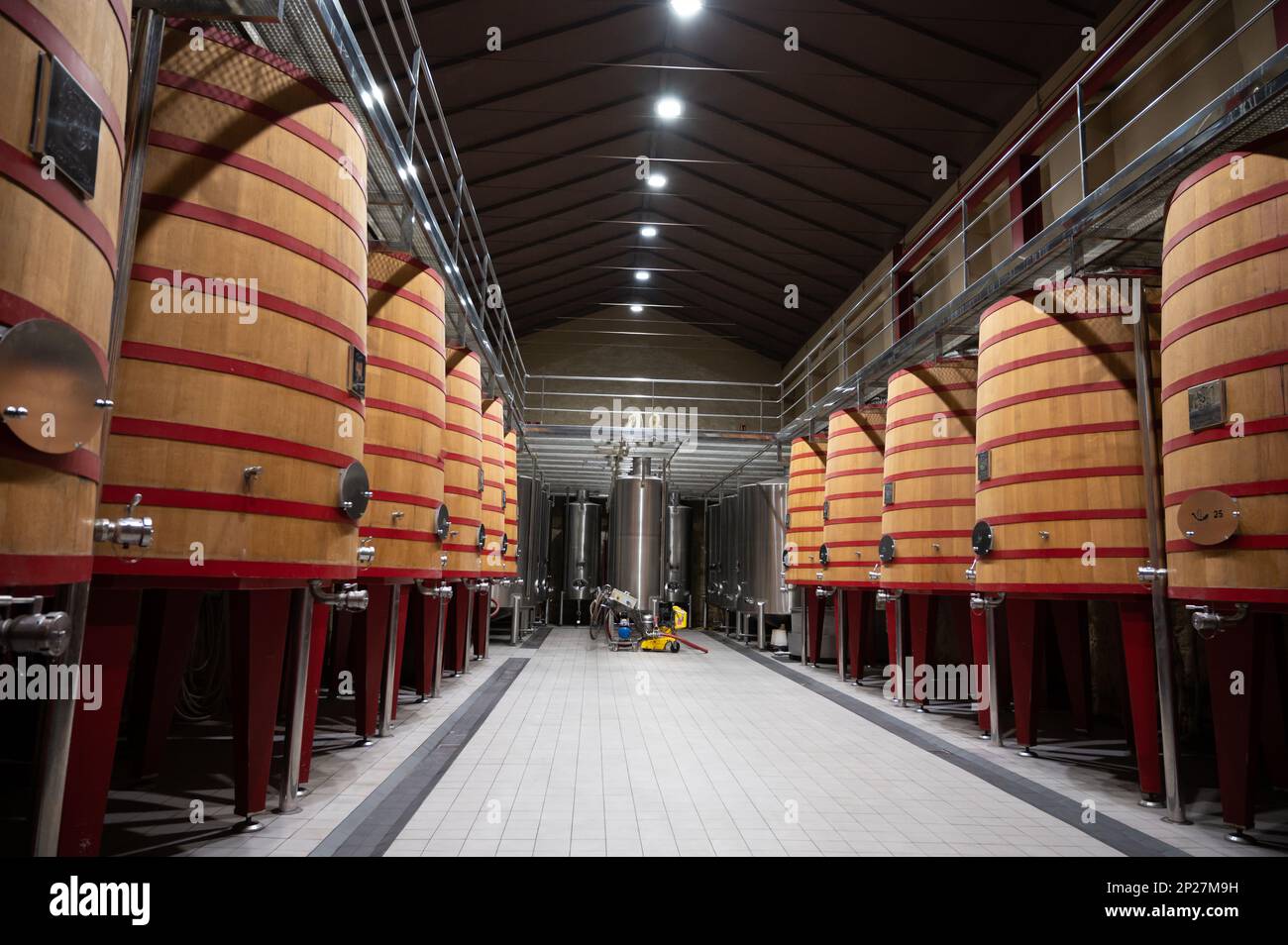 Modern large wooden barrels for wine fermentation process, red and white wine making in La Rioja ...
