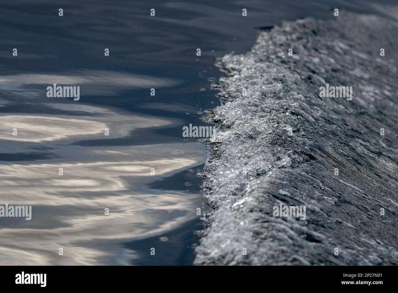 A small body of water flowing, with a gentle wave added to the surface ...