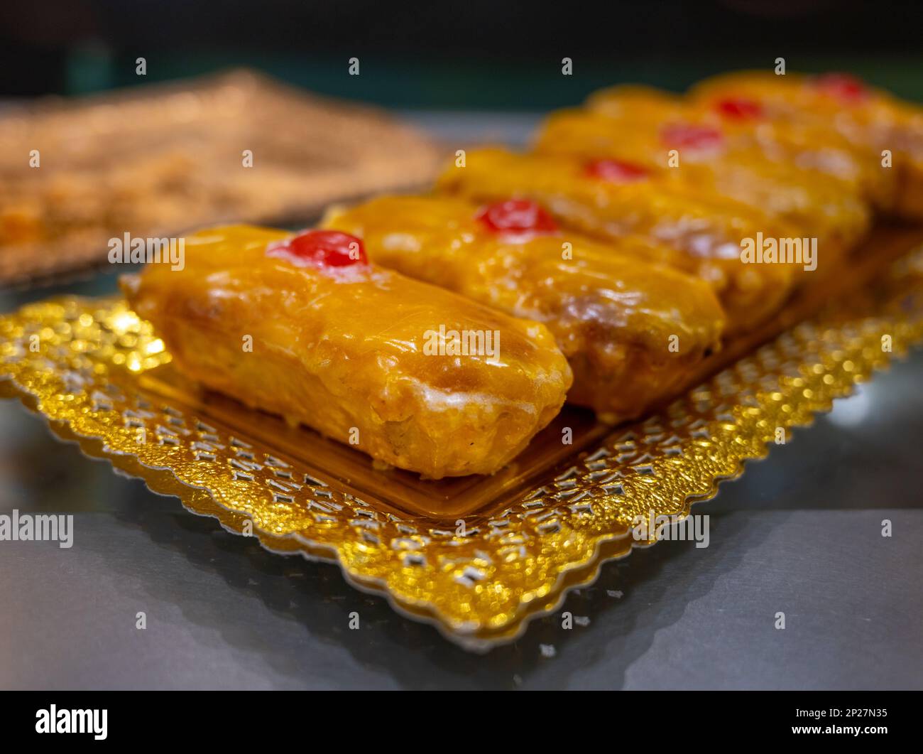 Delicious fresh baked colorful decorated cakes, tarts with cream and ...