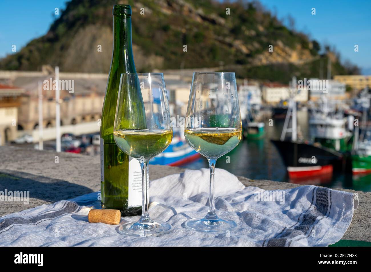 Tasting of txakoli or chacolí slightly sparkling very dry white wine ...