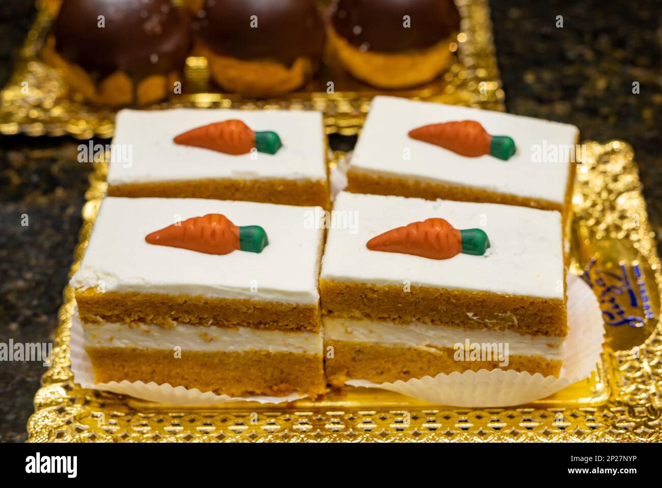 Delicious fresh baked colorful decorated cakes, tarts with cream and ...