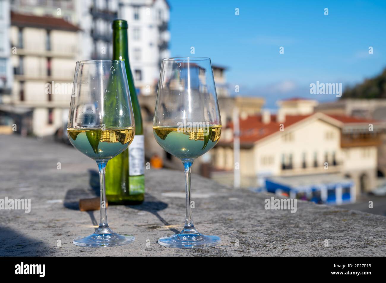 Tasting of txakoli or chacolí slightly sparkling very dry white wine ...