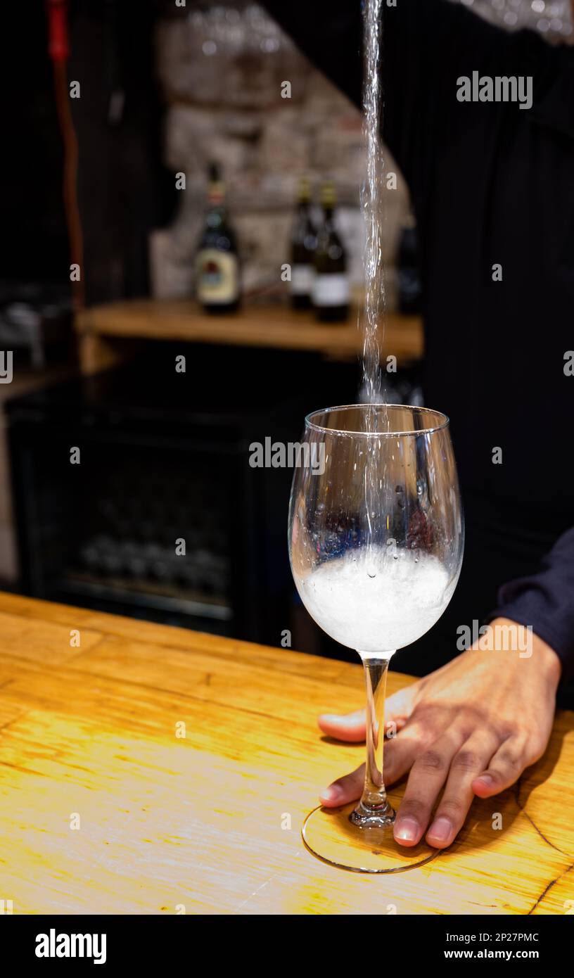 Pouring of txakoli or chacolí slightly sparkling very dry white wine ...