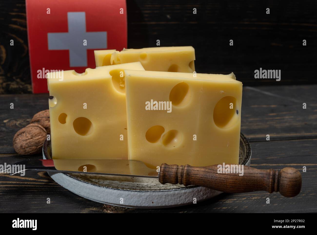 Block of Swiss medium-hard yellow cheese emmental or emmentaler with ...