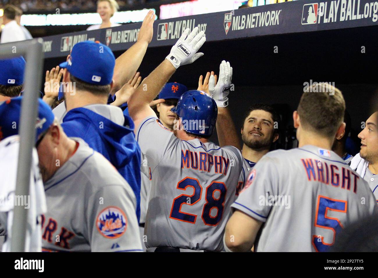 New York Mets second baseman Daniel Murphy (28) high fives with other ...