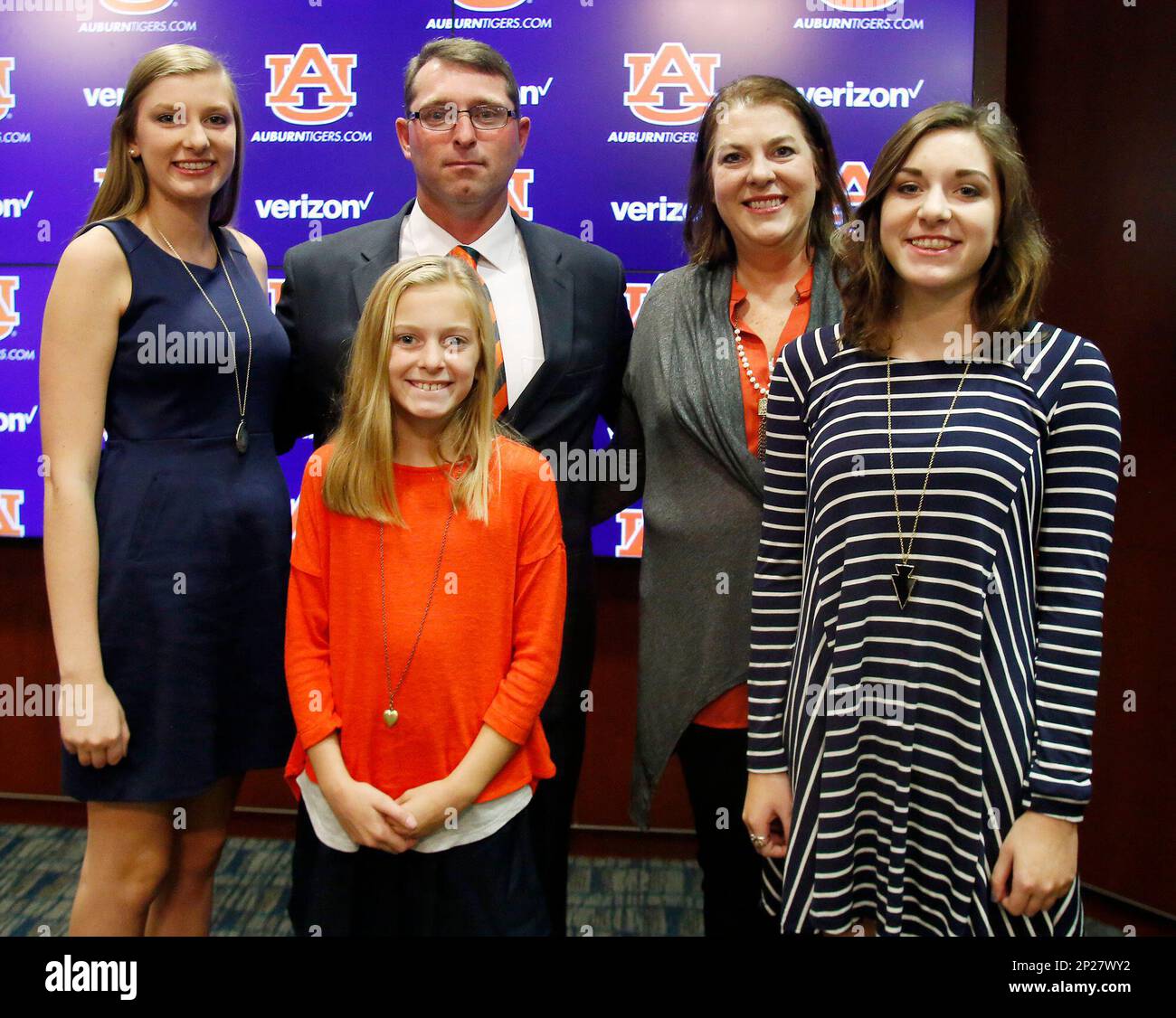 Auburn coach Butch Thompson poses for a family picture with with wife ...