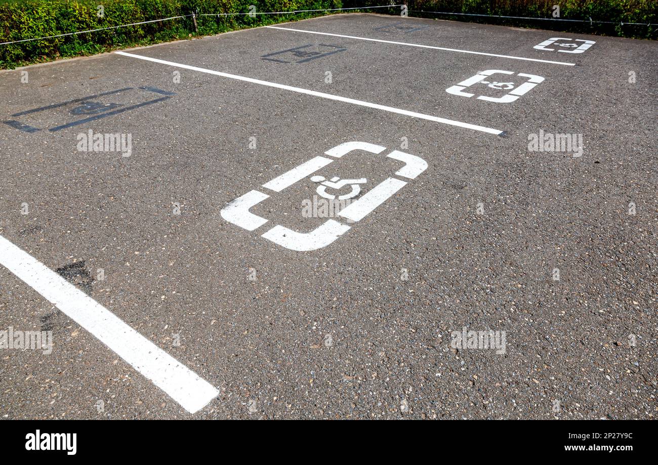 Parking places with handicapped or disabled signs and marking lines on ...