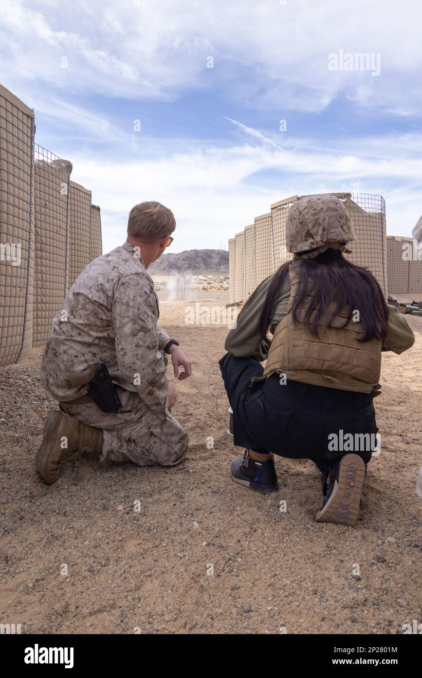 U.S. Marine Corps Sgt. Austin F. Howard, left, explosive ordnance ...