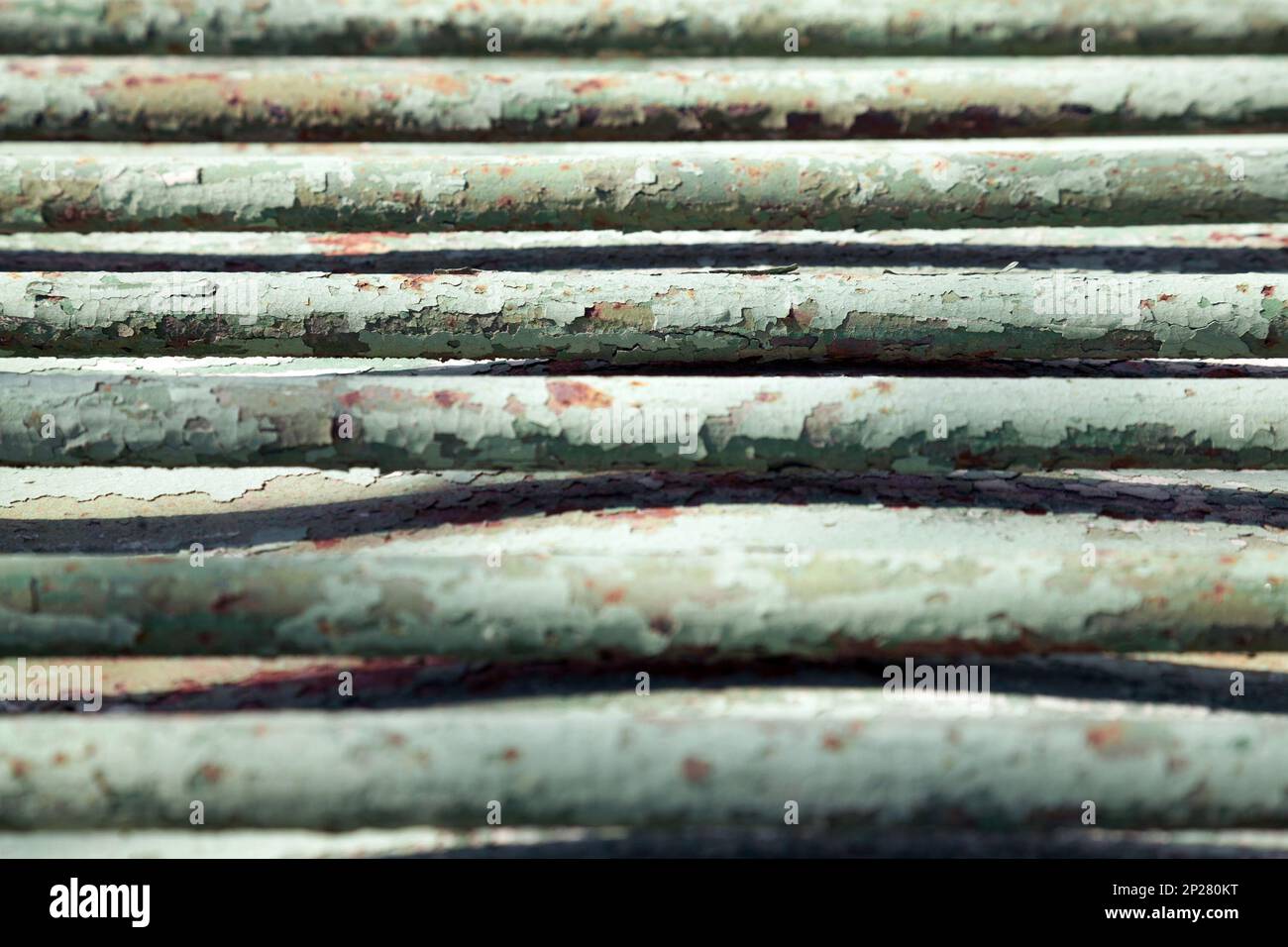 Old green metal bars close-up background. Geometrical pattern on a ...