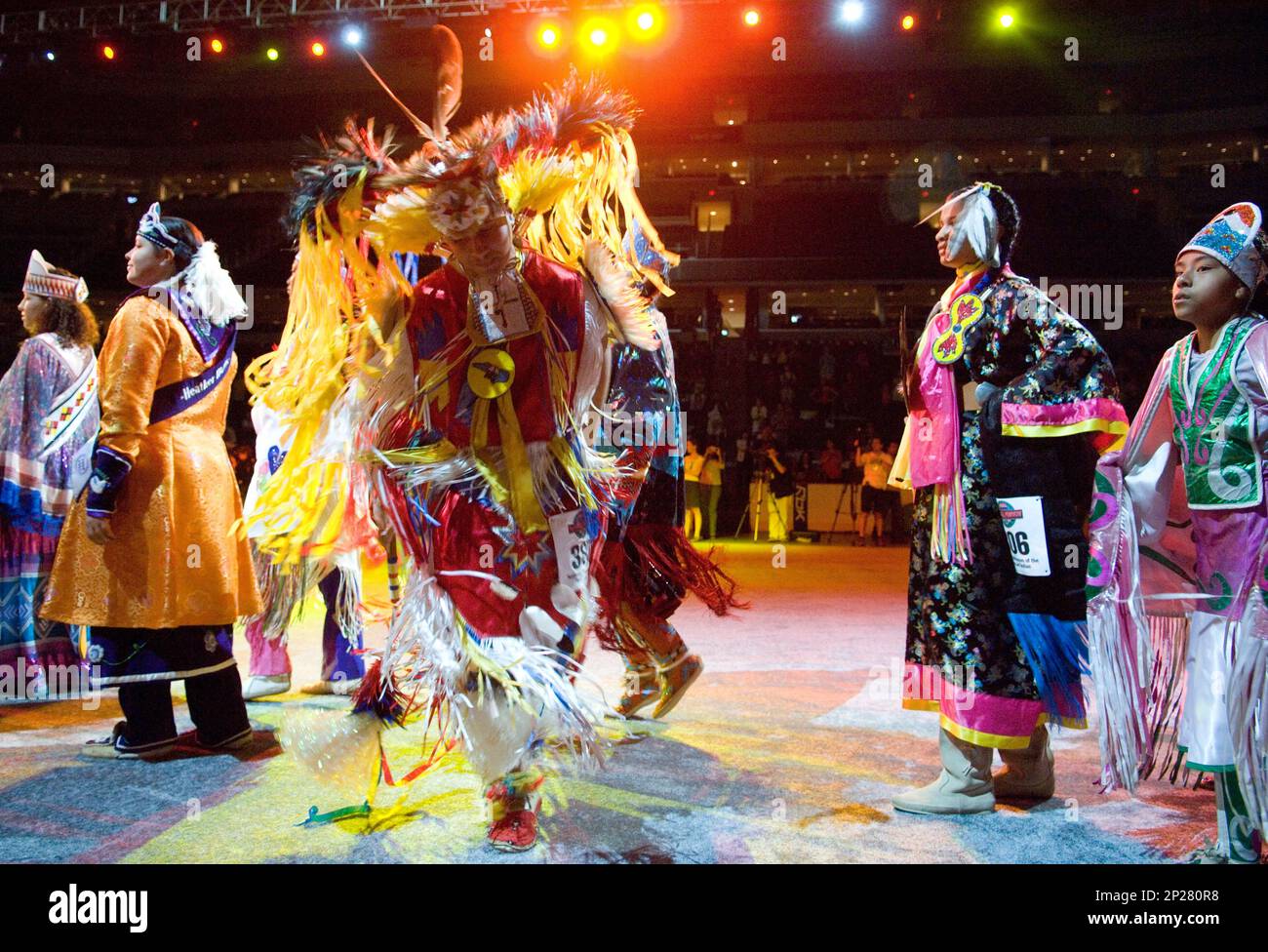 Native American dancers participate in the Grand Entry on the floor of ...