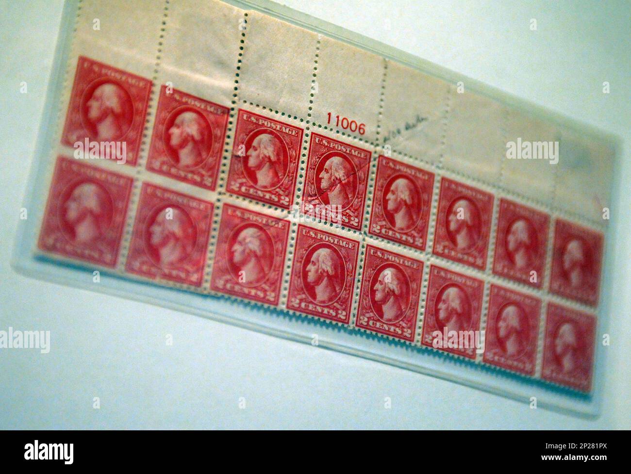 A tear on a block of 2 cent stamps form 1918 is part of the Smithsonian ...