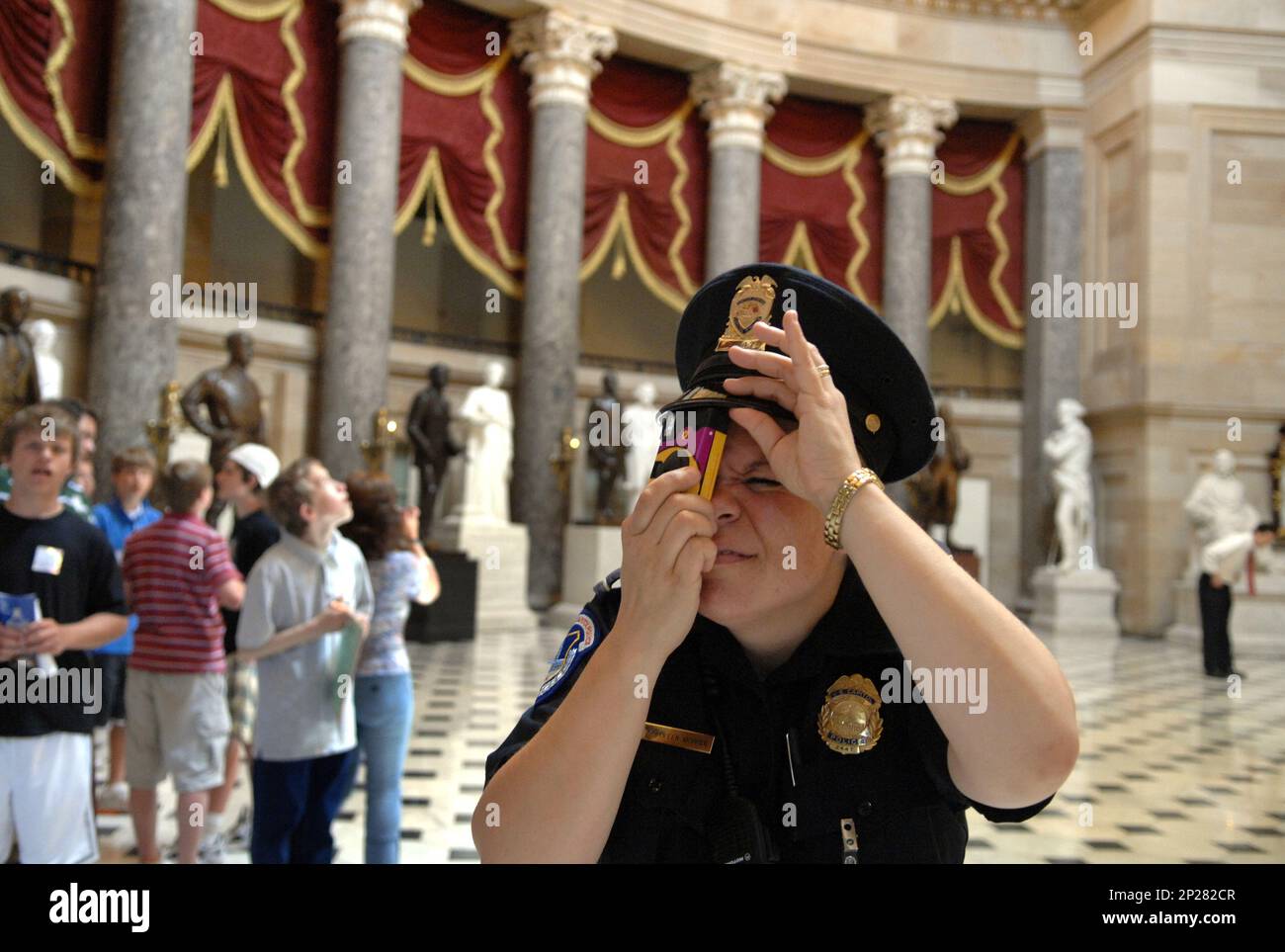 Capitol Police Officer Kathleen McBride takes a picture in Statuary ...