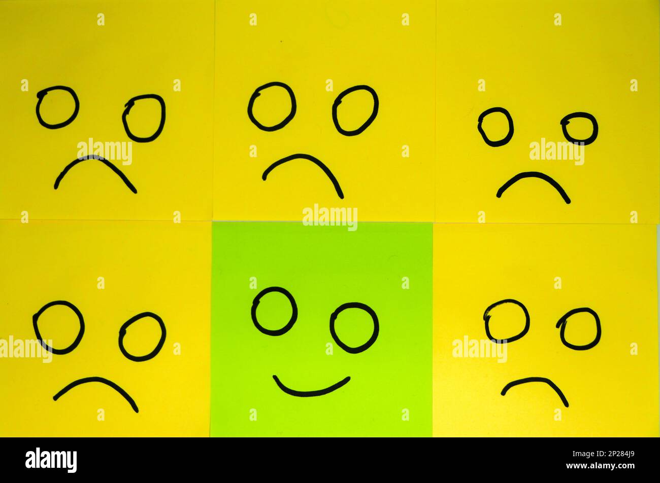 Emotions concept. Background of sticky notes. Green sticky note and ...