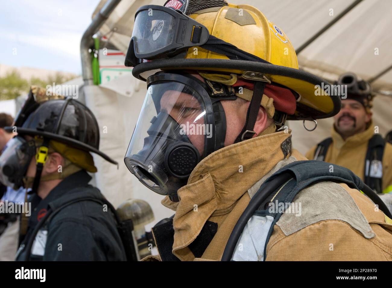 Firefighters wait their turn during the Firefighter Combat Challenge ...