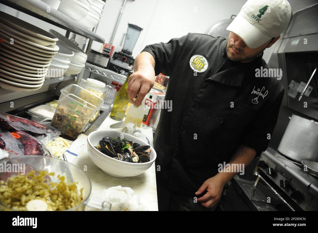 Teddy Folkman, executive chef/owner of Granville Moore's, prepares a ...