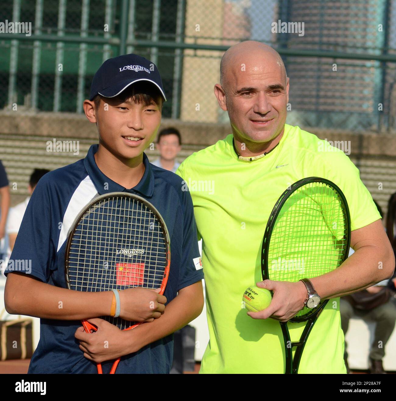Retired American tennis star Andre Agassi, right, and young Chinese ...