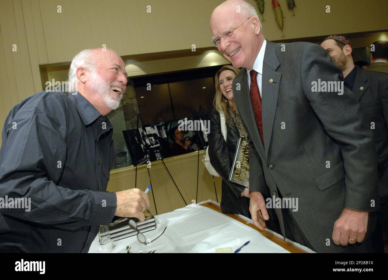 Photographer David Hume Kennerly, left, shares a laugh with Sen. Pat ...