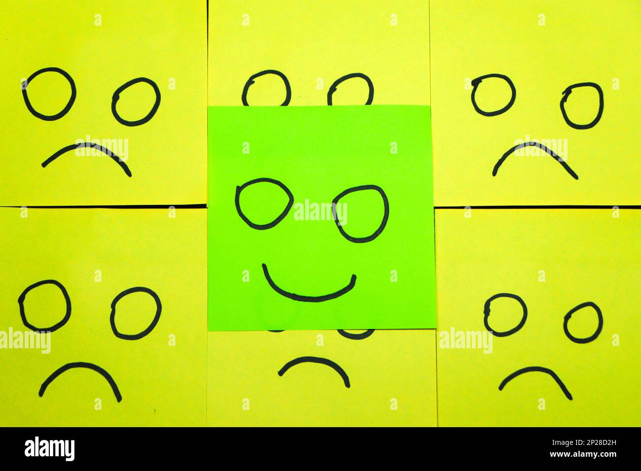 Emotions concept. Background of sticky notes. Green sticky note is ...
