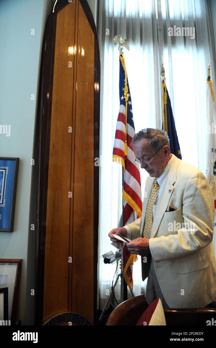 Sen. Ted Stevens, R-Alaska, talks about a storm surfboard made in 1939 ...