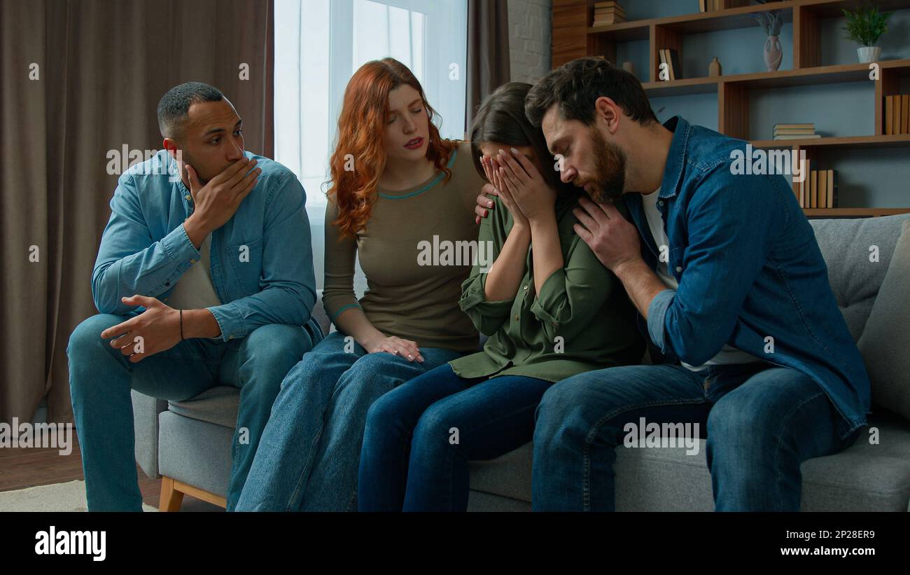 Multiracial 30s diverse people sit indoors sad crying woman sharing ...