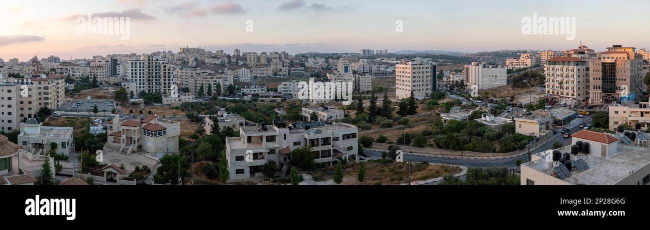 Wide Ramallah Cityscape at Dawn with Sunset, High Buildings, and Trees ...