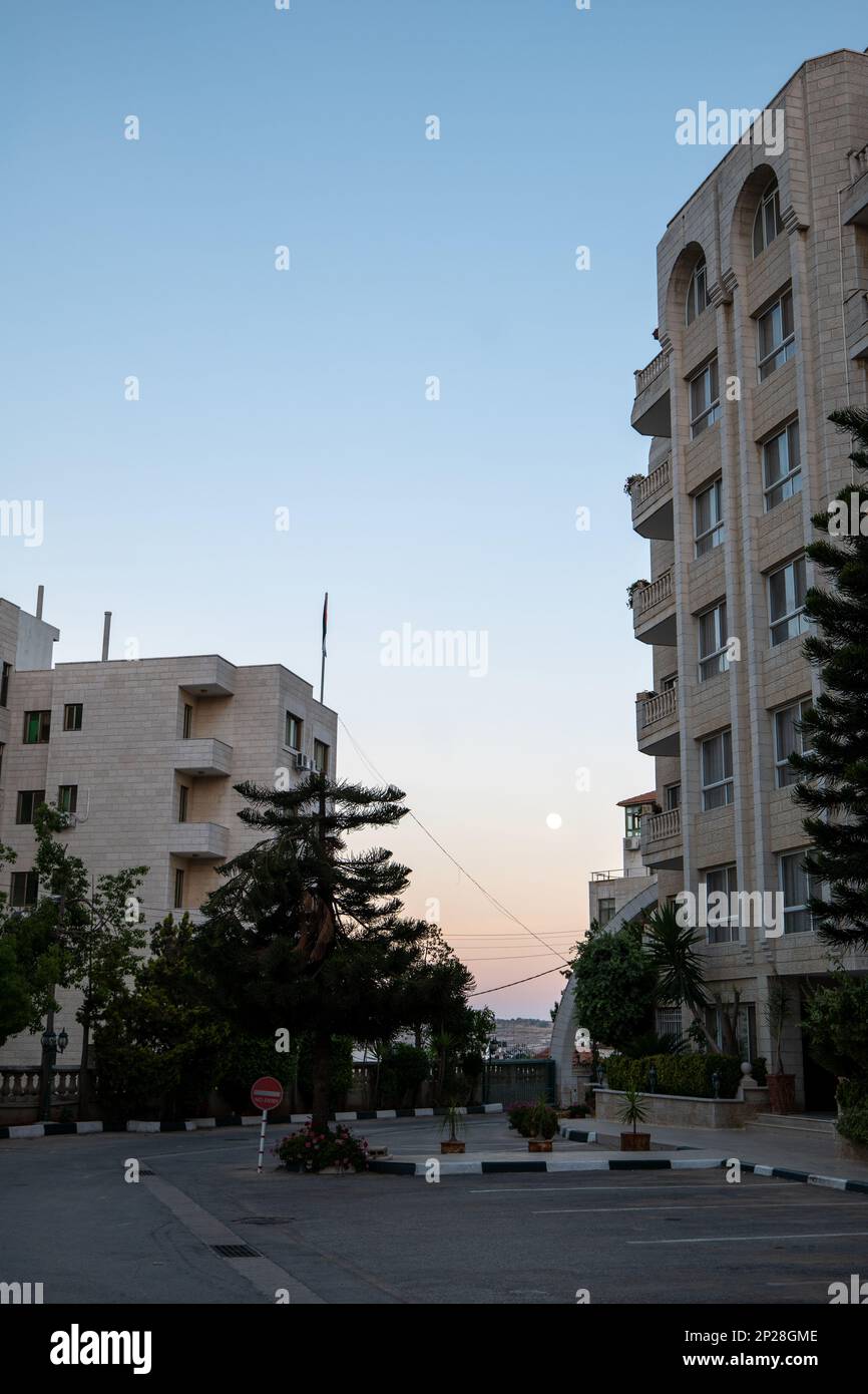 Ramallah White Buildings with Trees and Red Warning Sign at Dawn Stock ...