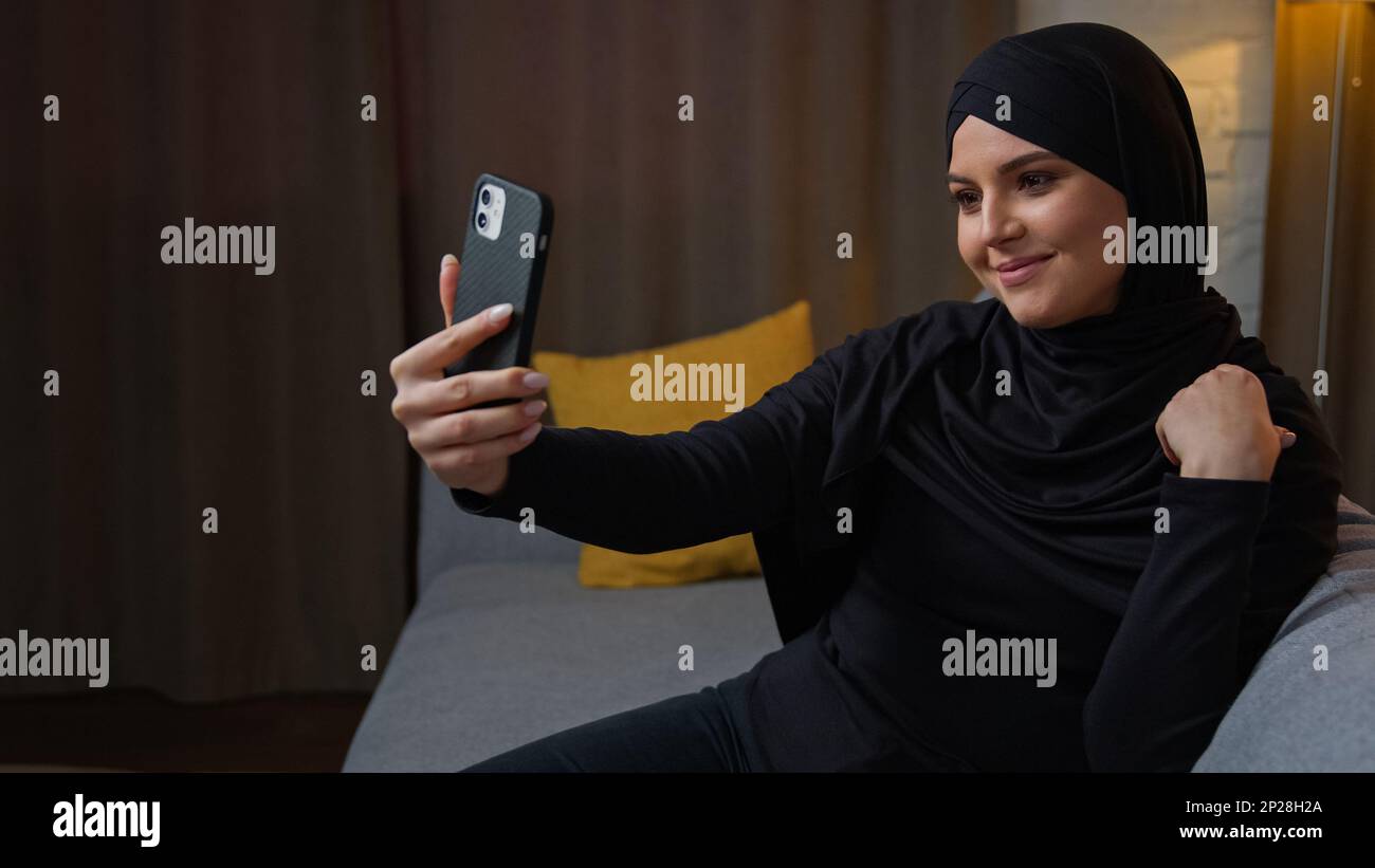 Islamic muslim woman 20s girl use mobile phone webcam conference app ...