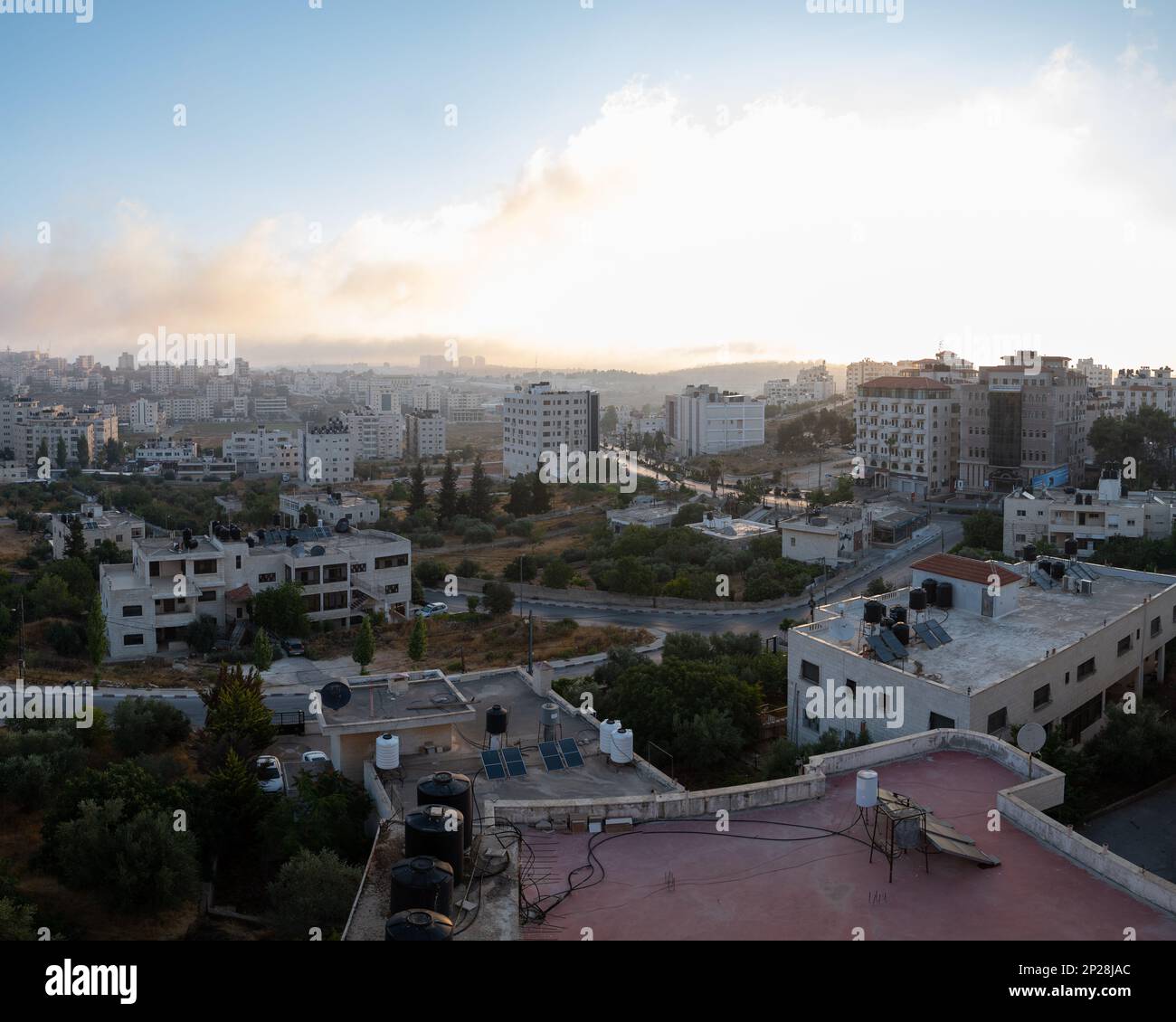 Ramallah Cityscape at Dawn with Sunset, High Buildings and Trees Facing ...
